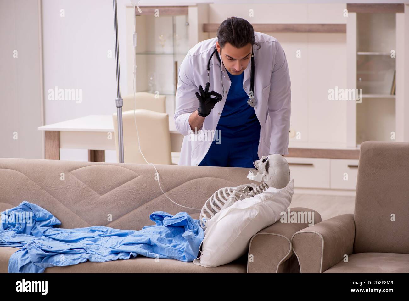 Male paramedic visiting skeleton patient Stock Photo - Alamy