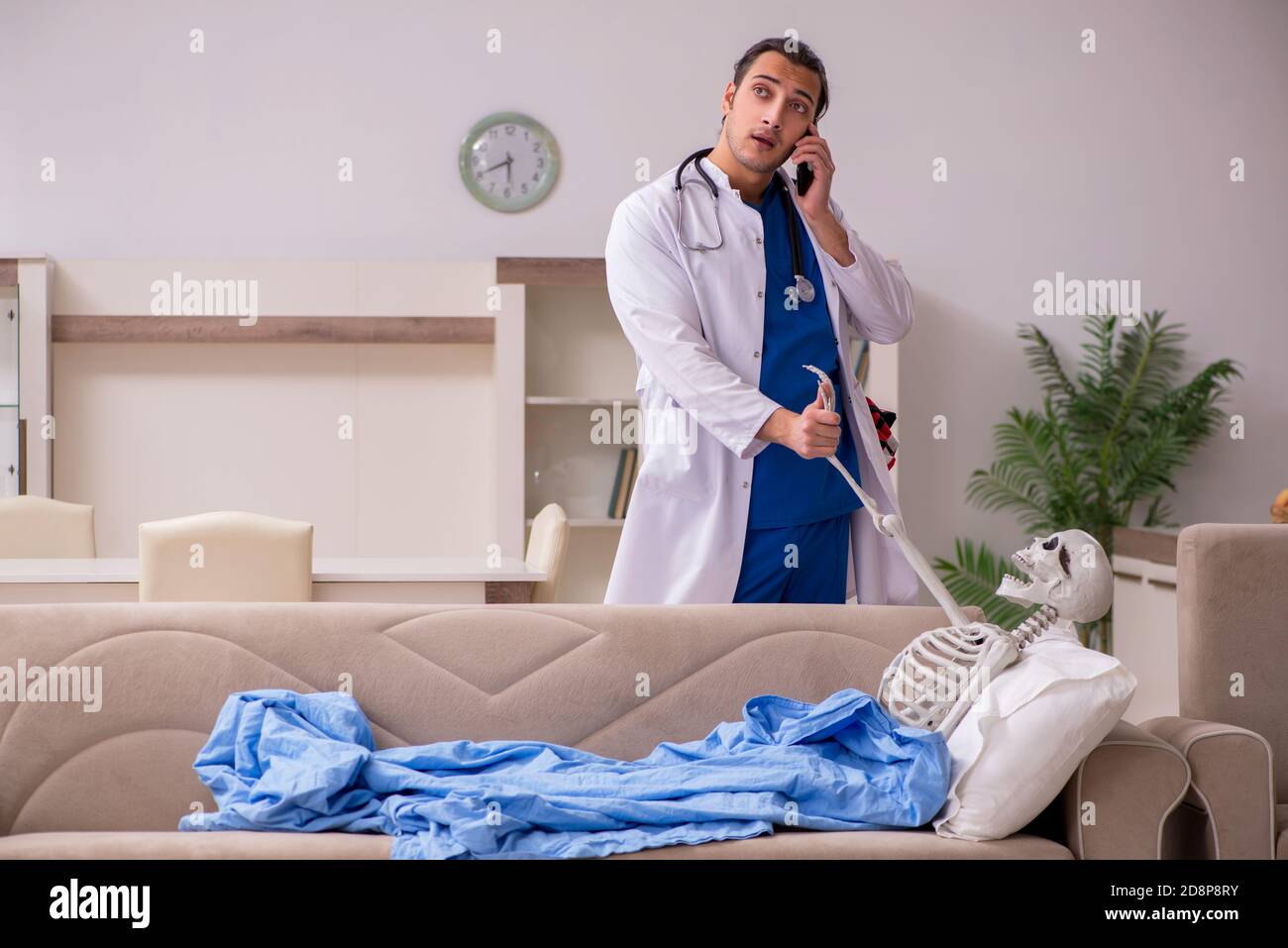 Male paramedic visiting skeleton patient Stock Photo - Alamy