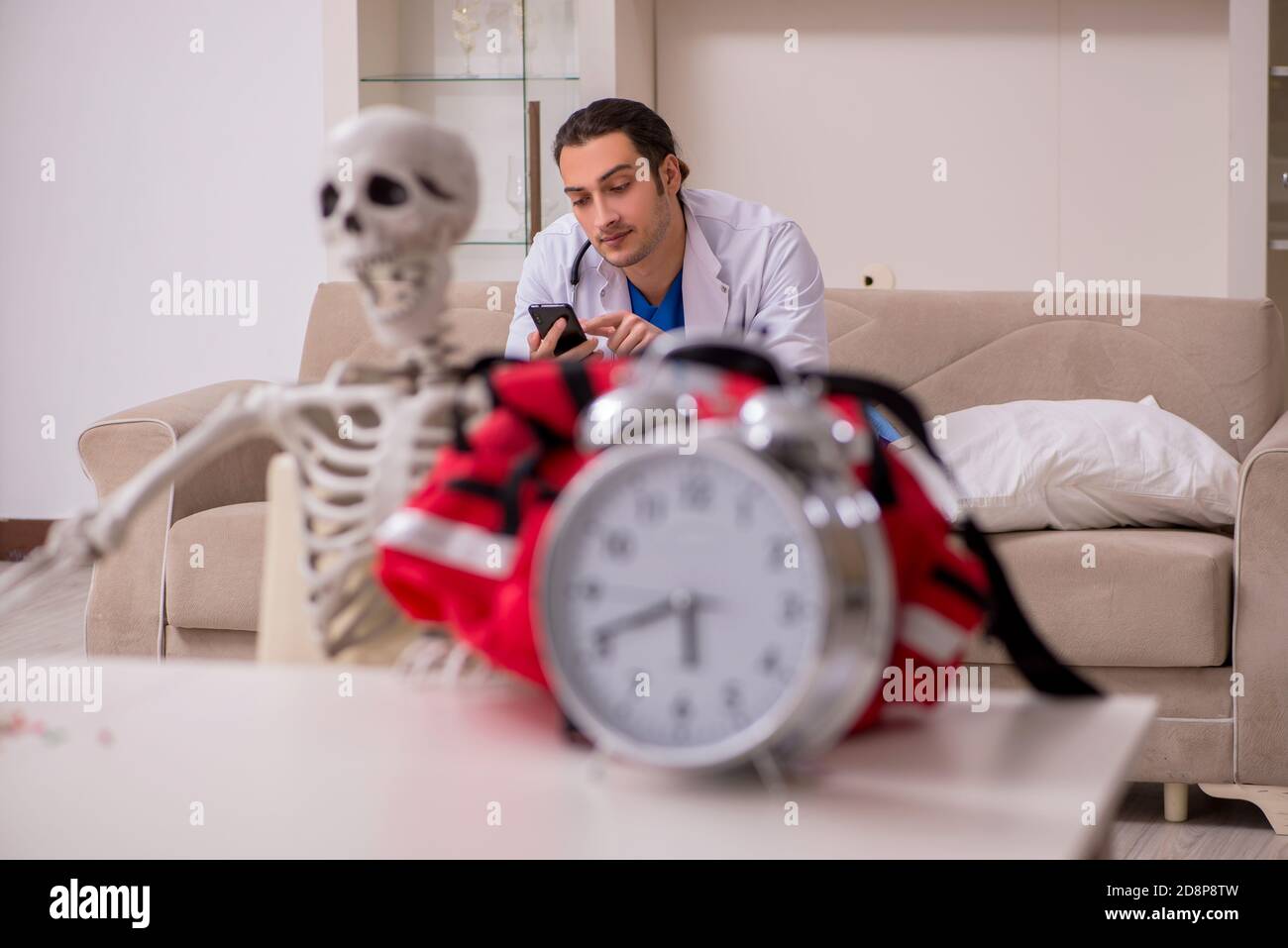 Male paramedic visiting skeleton patient Stock Photo - Alamy