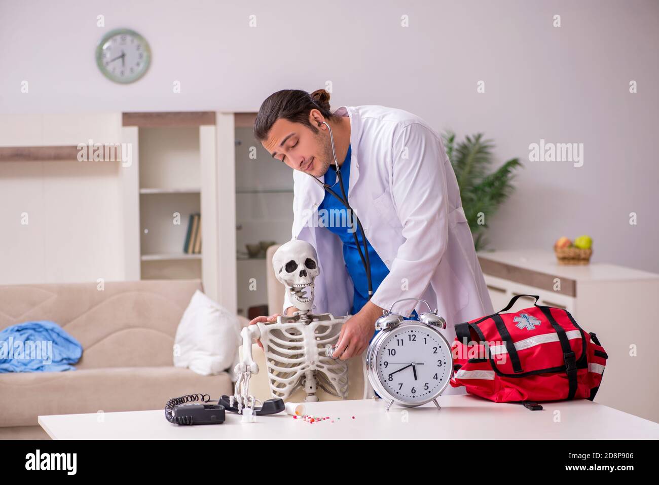 Male paramedic visiting skeleton patient Stock Photo - Alamy