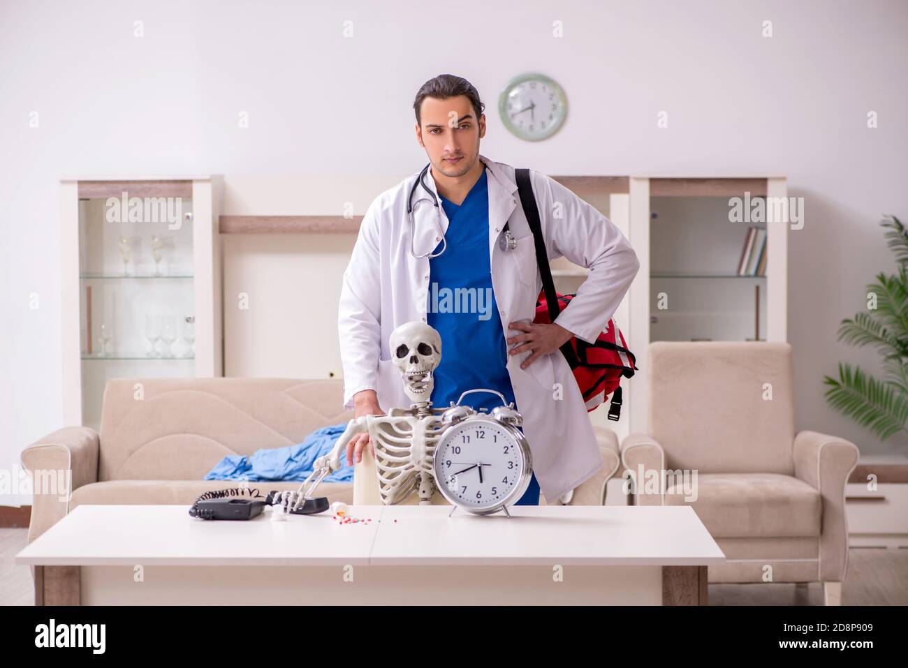 Male paramedic visiting skeleton patient Stock Photo - Alamy