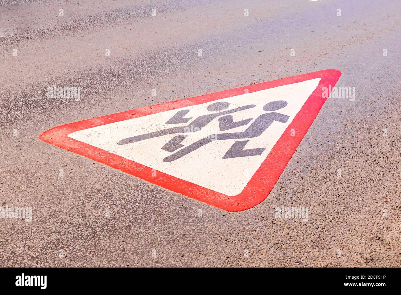 "beware of pedestrians" sign on the asphalt Stock Photo - Alamy
