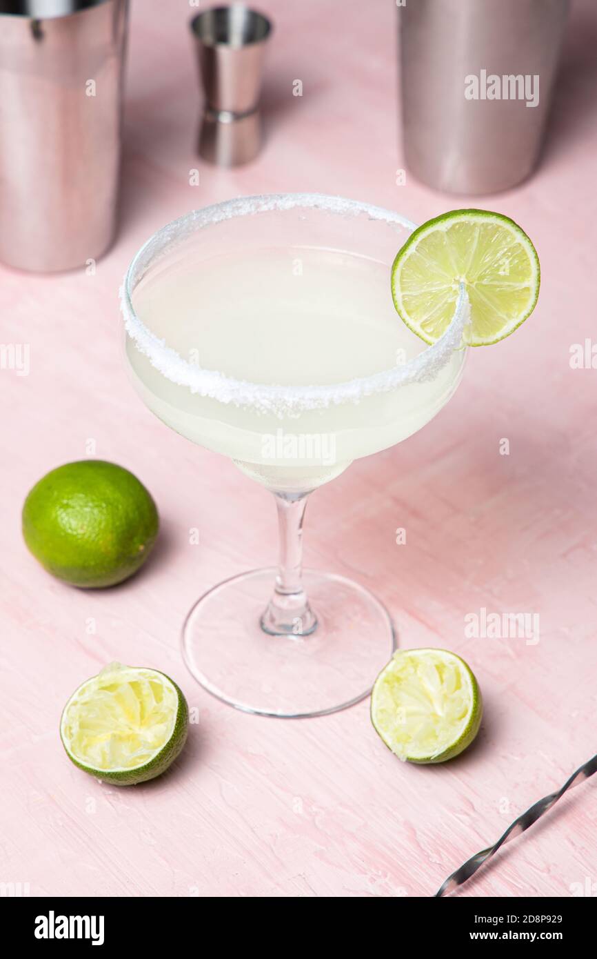 Margarita cocktail with lime wheel in a salt-rimmed glass Stock Photo ...