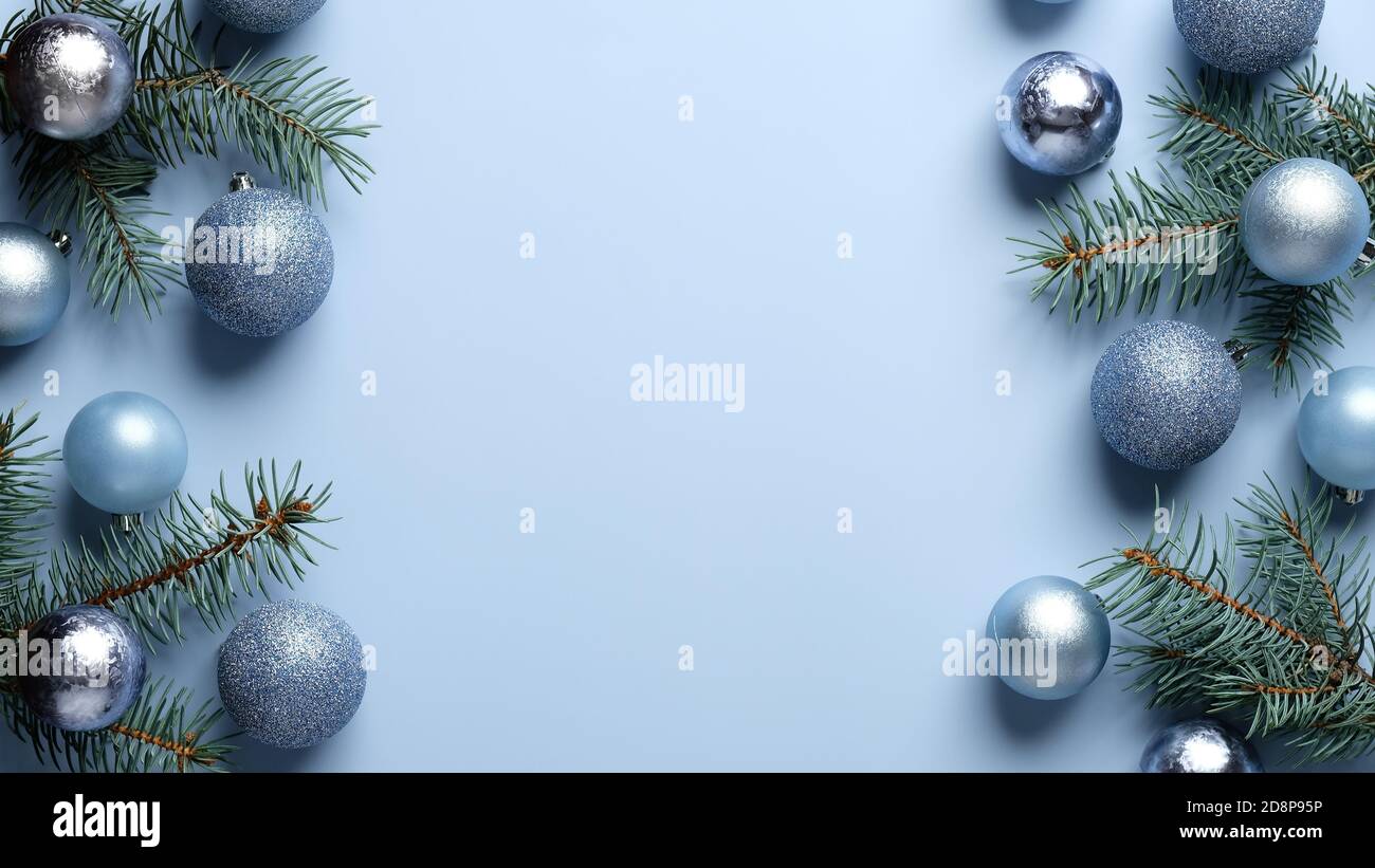 Blue Christmas background with pine tree branches and shiny balls ...
