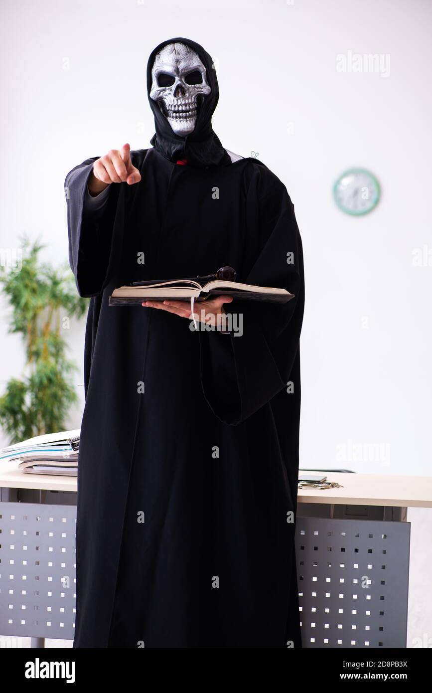 Devil judge working in the courthouse Stock Photo - Alamy