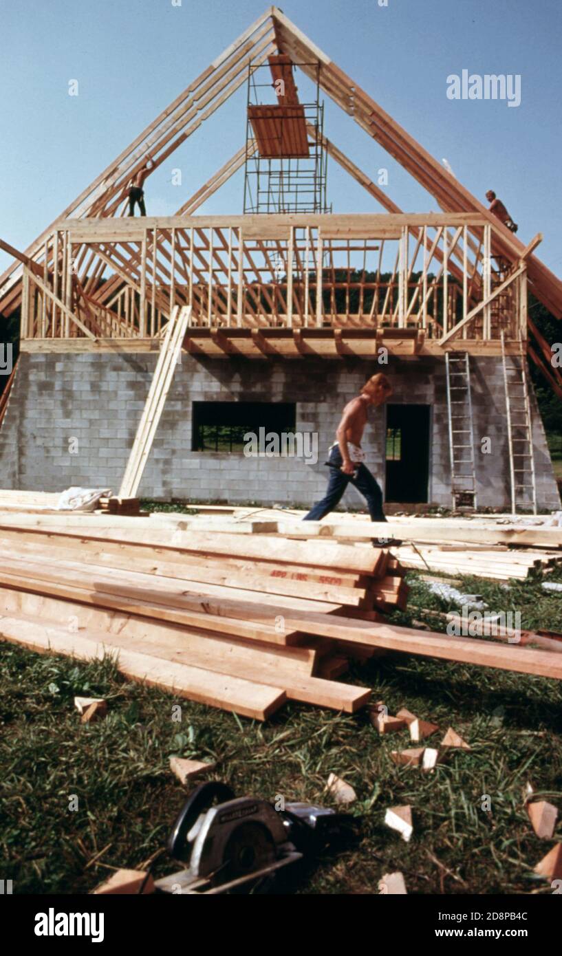 Carpenters at work on the first unit of the new alpine village at the ...
