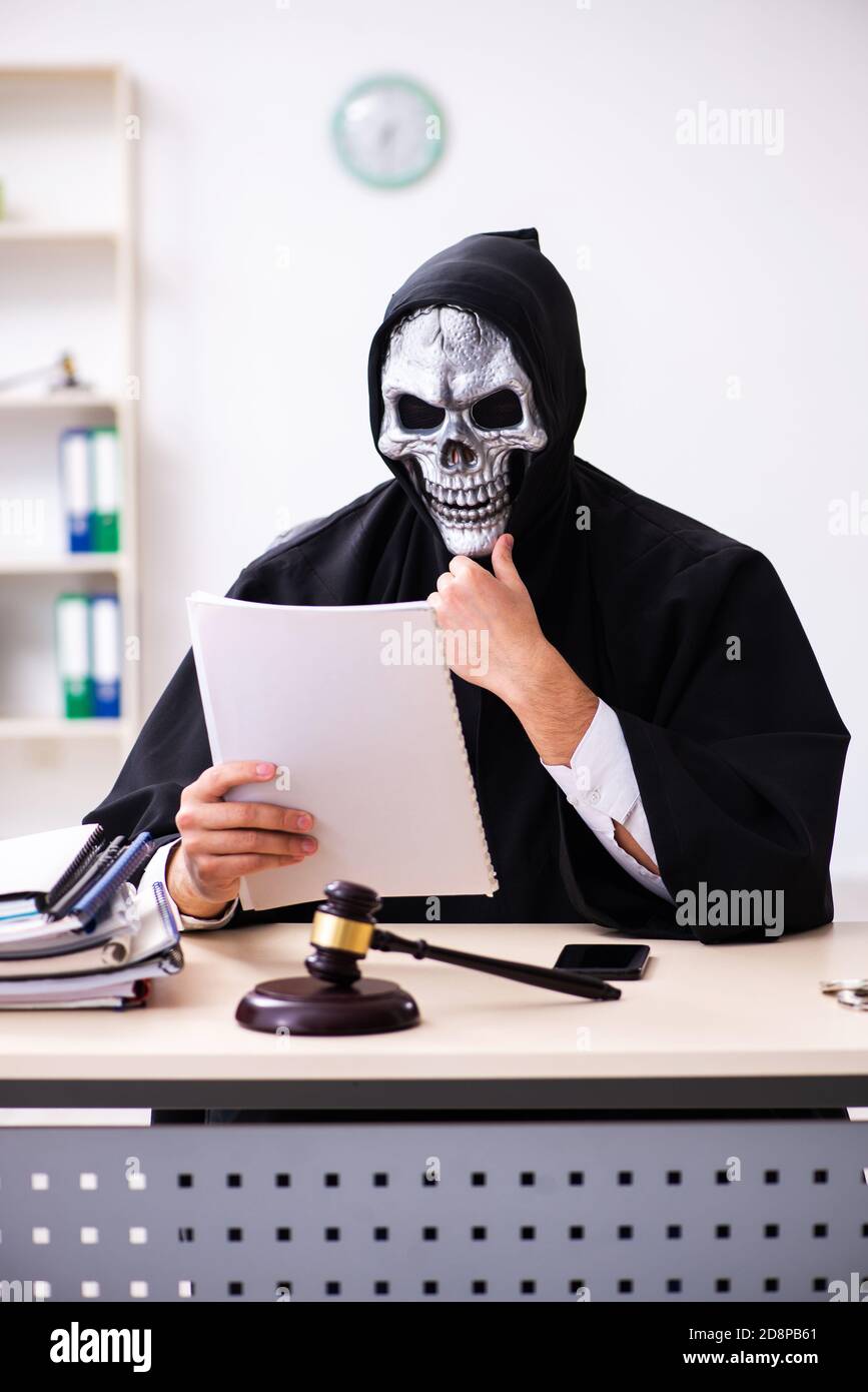 Devil judge working in the courthouse Stock Photo - Alamy