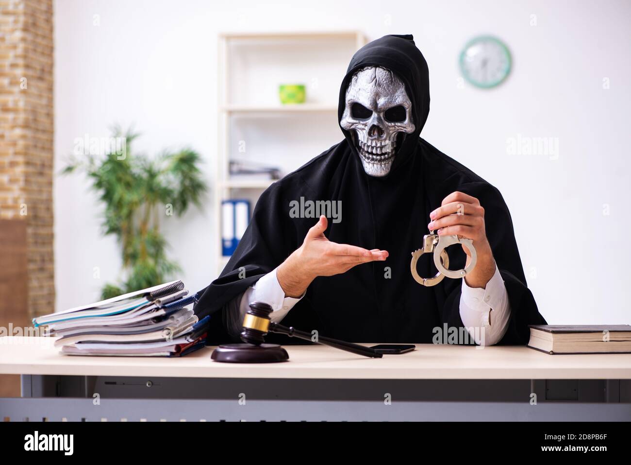 Devil judge working in the courthouse Stock Photo - Alamy