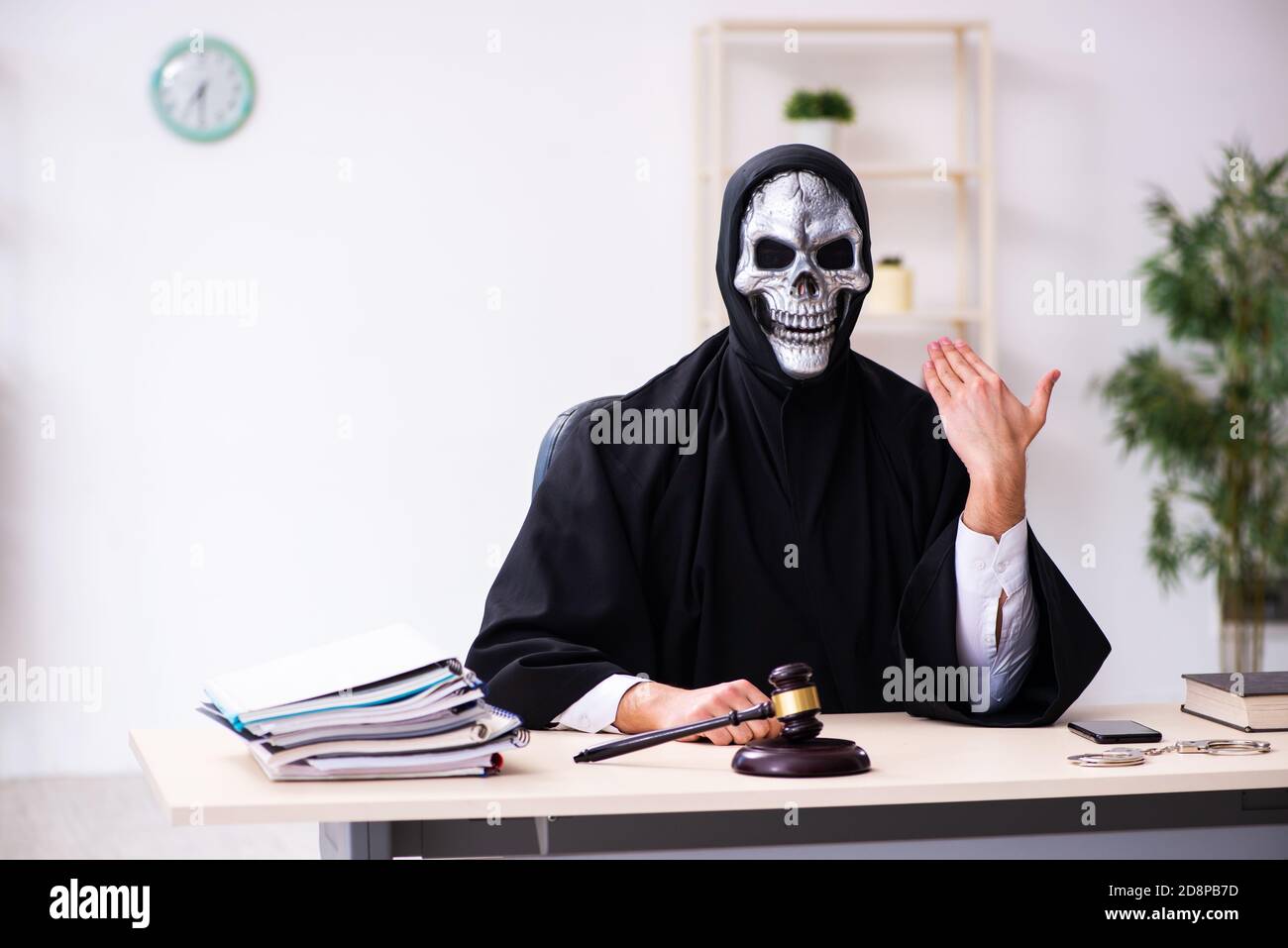 Devil judge working in the courthouse Stock Photo - Alamy