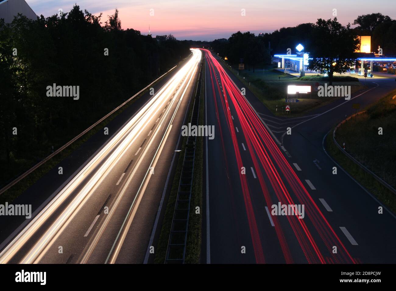 Long exposure of the Autobahn (highway) with sunset Stock Photo - Alamy