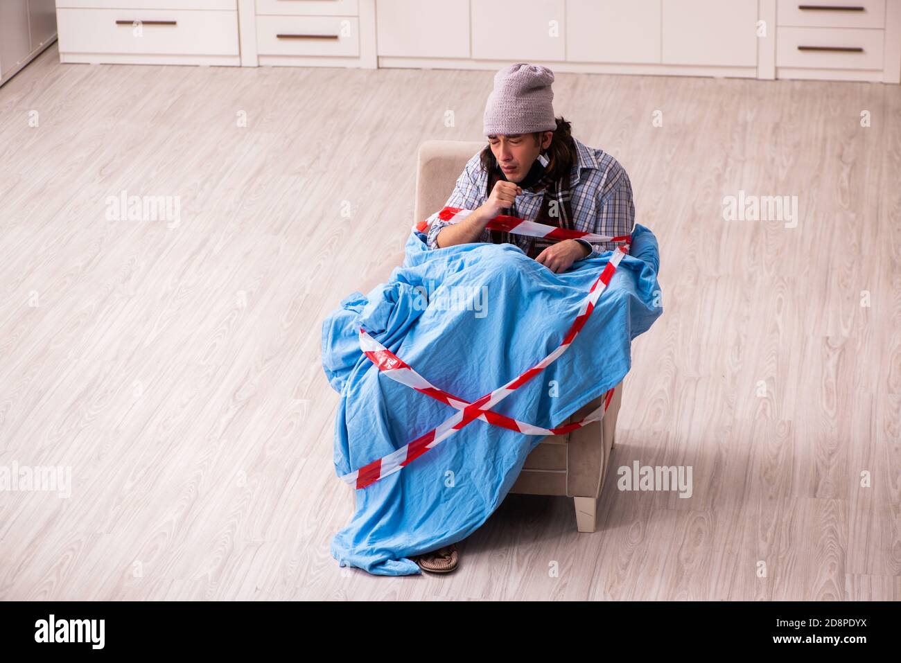 Sick man suffering at home in pandemic concept Stock Photo - Alamy