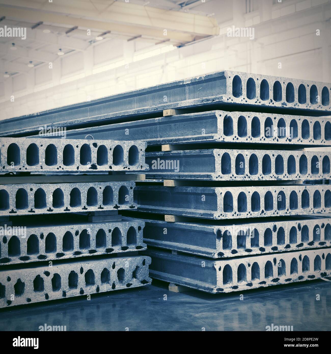 Stack of precast reinforced concrete slabs in a house-building factory ...