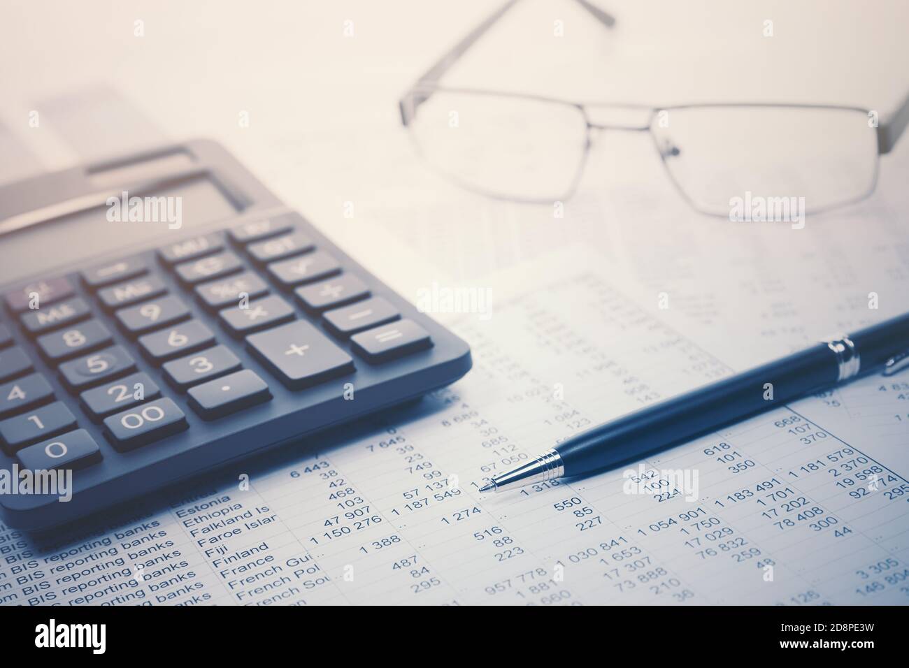 Financial accounting Pen and calculator on balance sheets Stock Photo ...