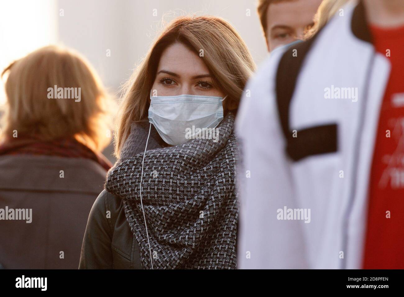 Beijing, Poland. 8th Oct, 2020. A woman wearing a face mask walks in ...