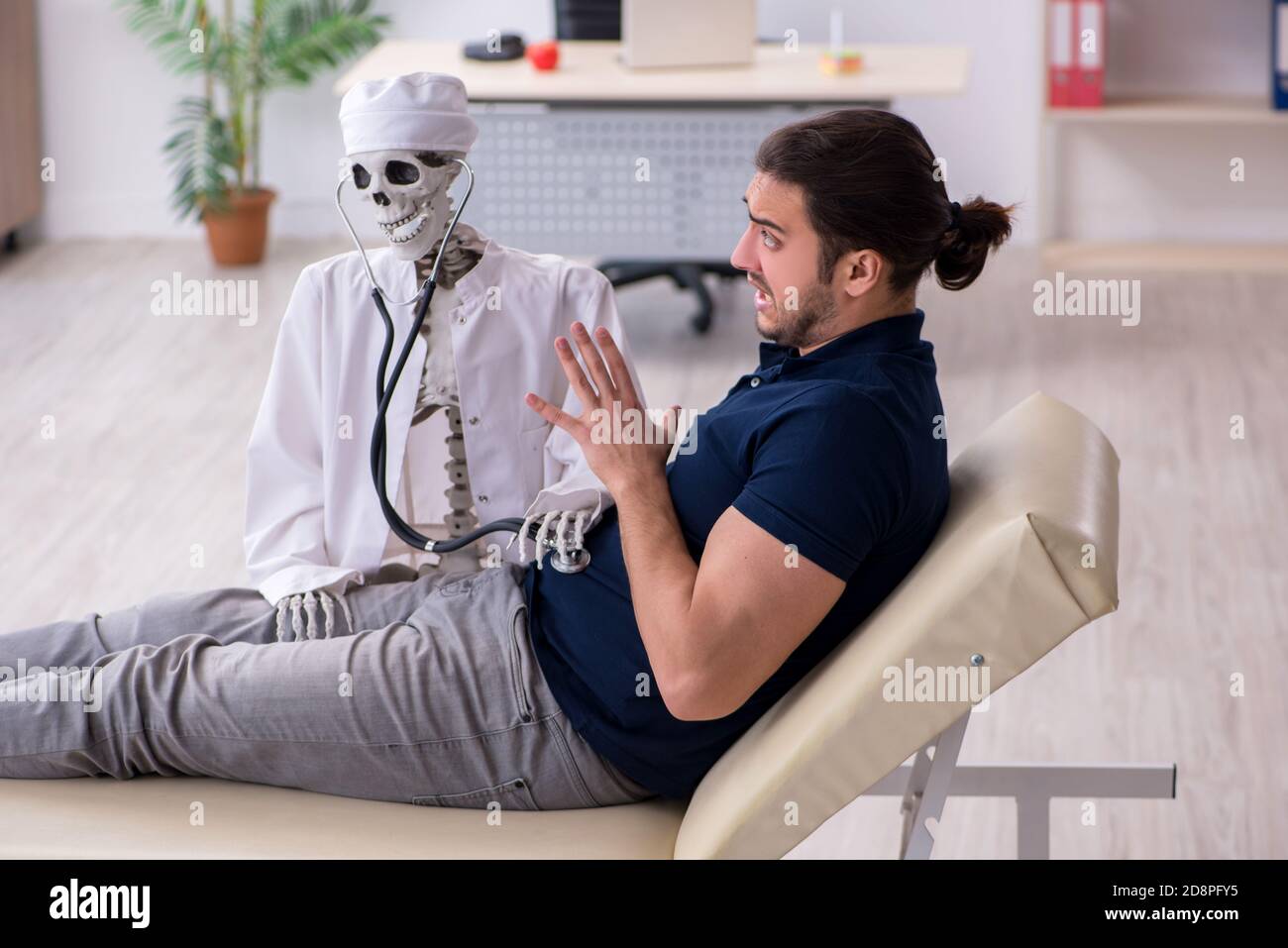 Young man visiting dead doctor in hospital Stock Photo - Alamy