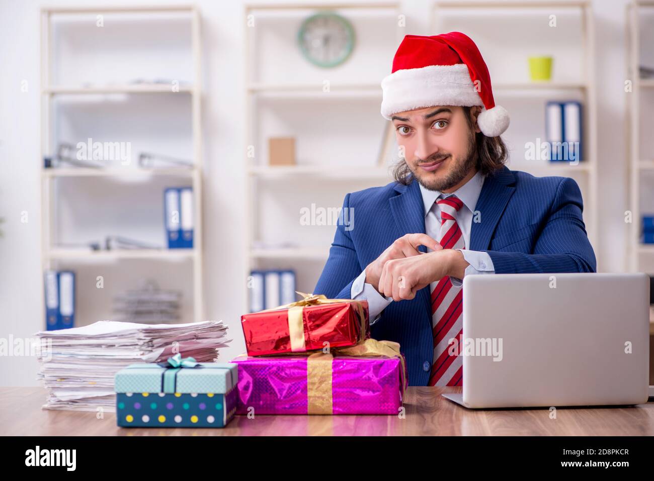 Young employee working in the office at Christmas Eve Stock Photo - Alamy Young employee working in the office at Christmas Eve Stock Photo - Alamy