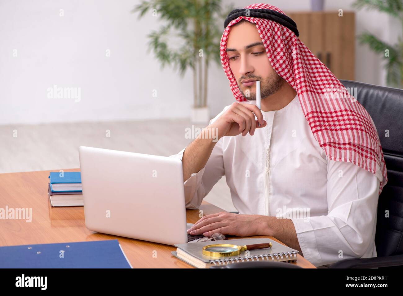 Male arab employee working in the office Stock Photo - Alamy