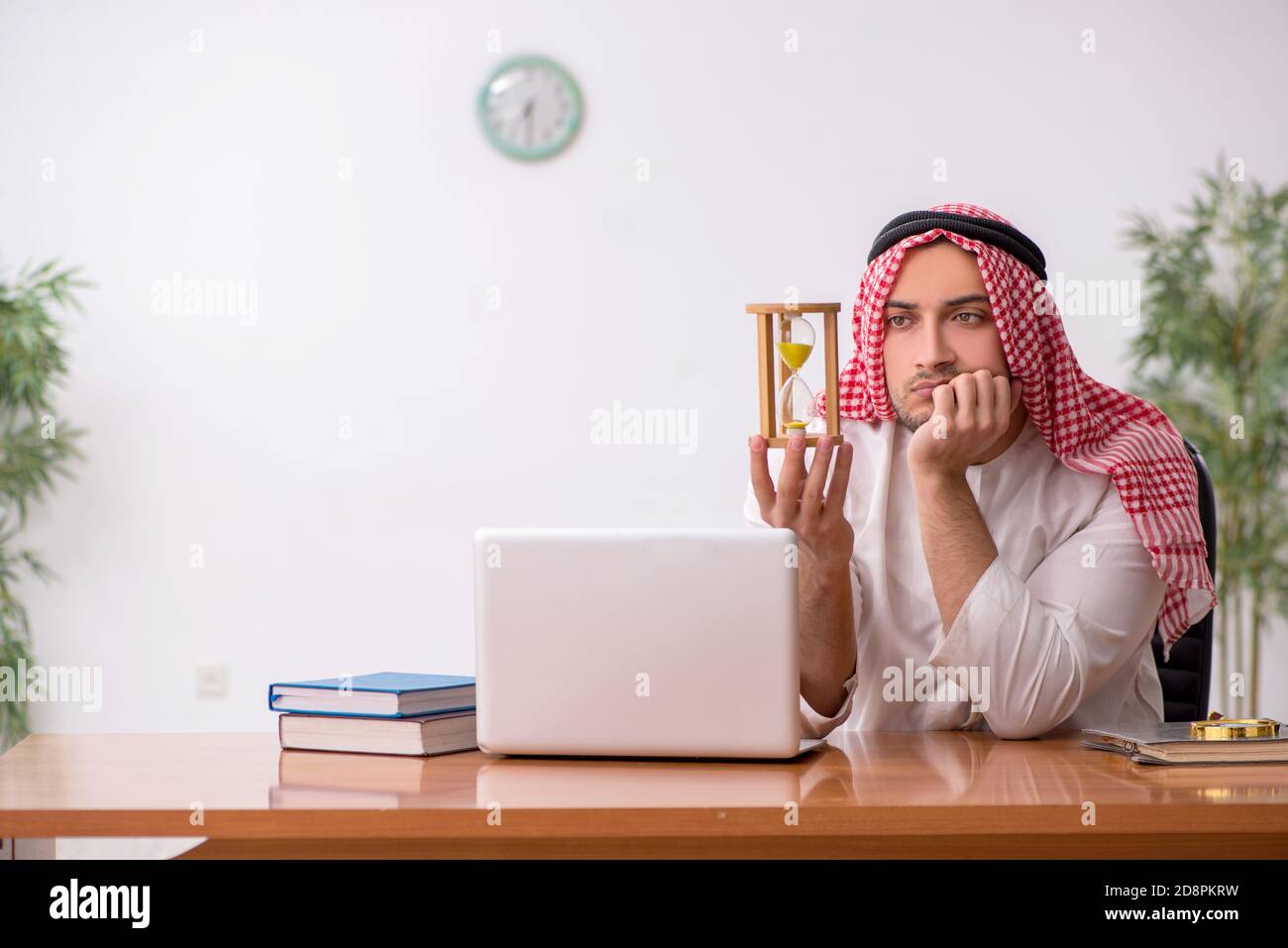 Male arab employee working in the office Stock Photo - Alamy