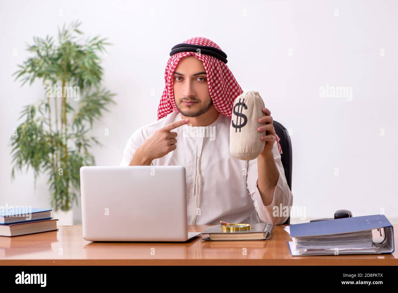 Male arab employee working in the office Stock Photo - Alamy