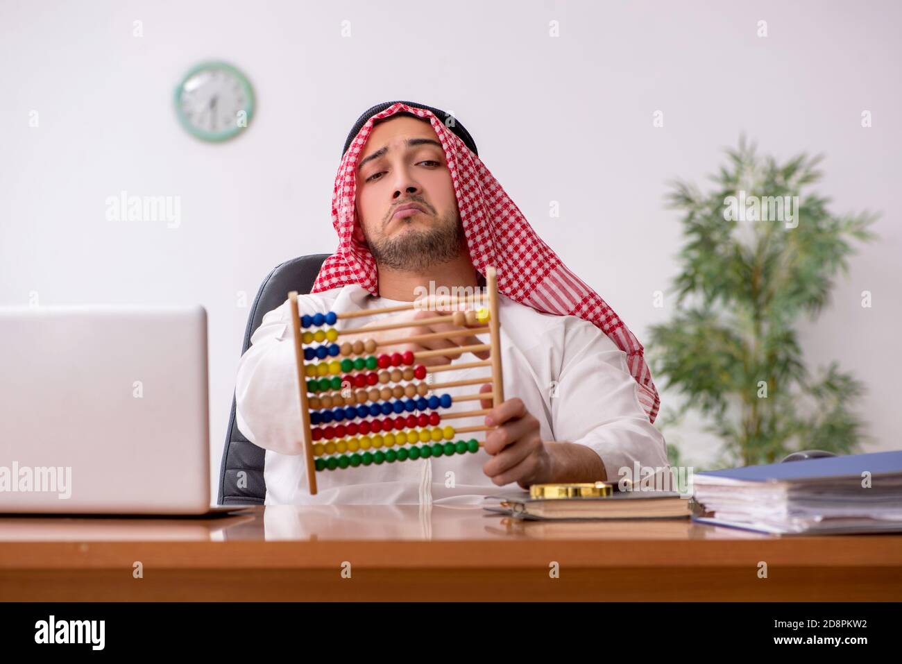 Male arab employee working in the office Stock Photo - Alamy