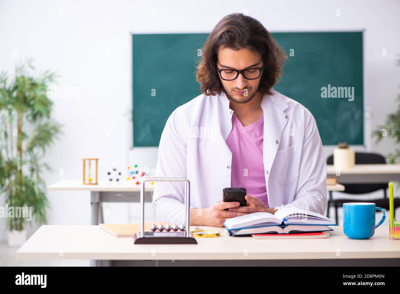 Young physicist in the classroom Stock Photo - Alamy