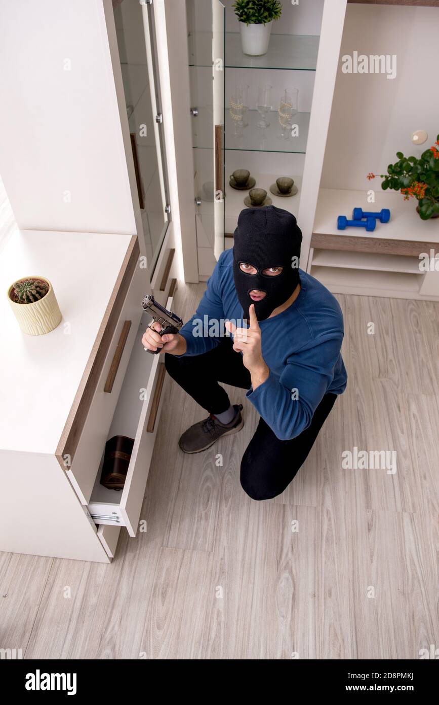 Camera view of robber stealing valuable things from the house Stock ...