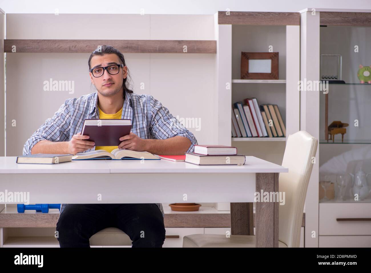 Male student preparing for exam at home Stock Photo - Alamy
