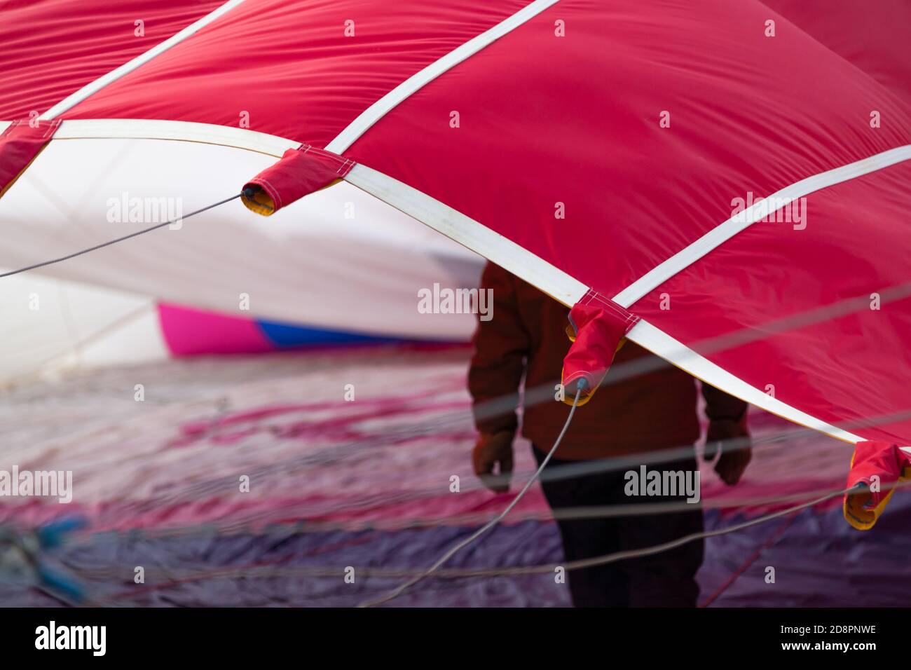 The edge of a hot air balloon as its being inflated, rising up to ...