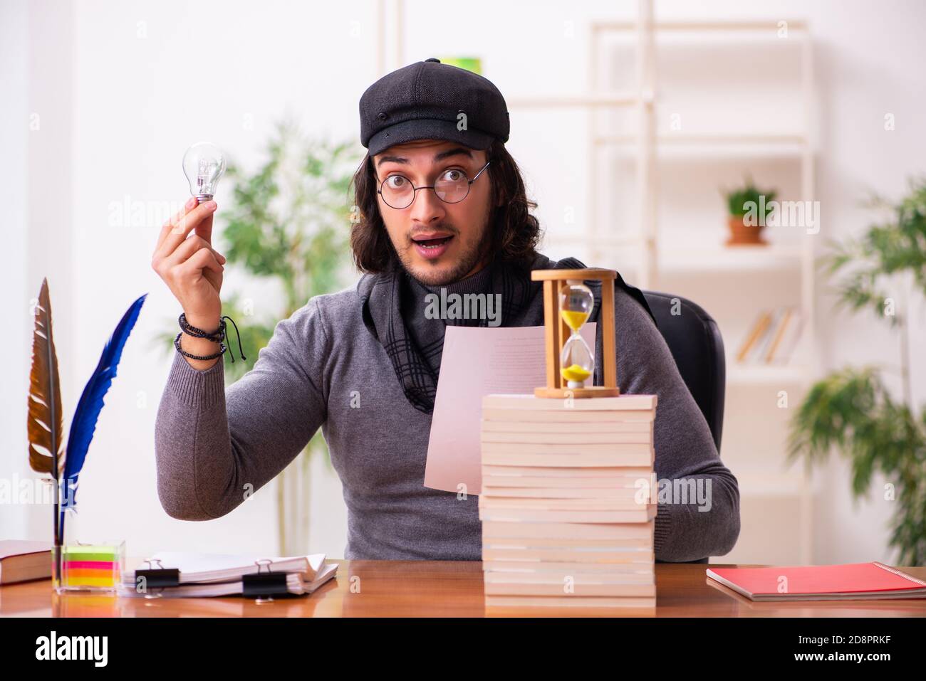 Male writer in time management concept Stock Photo - Alamy