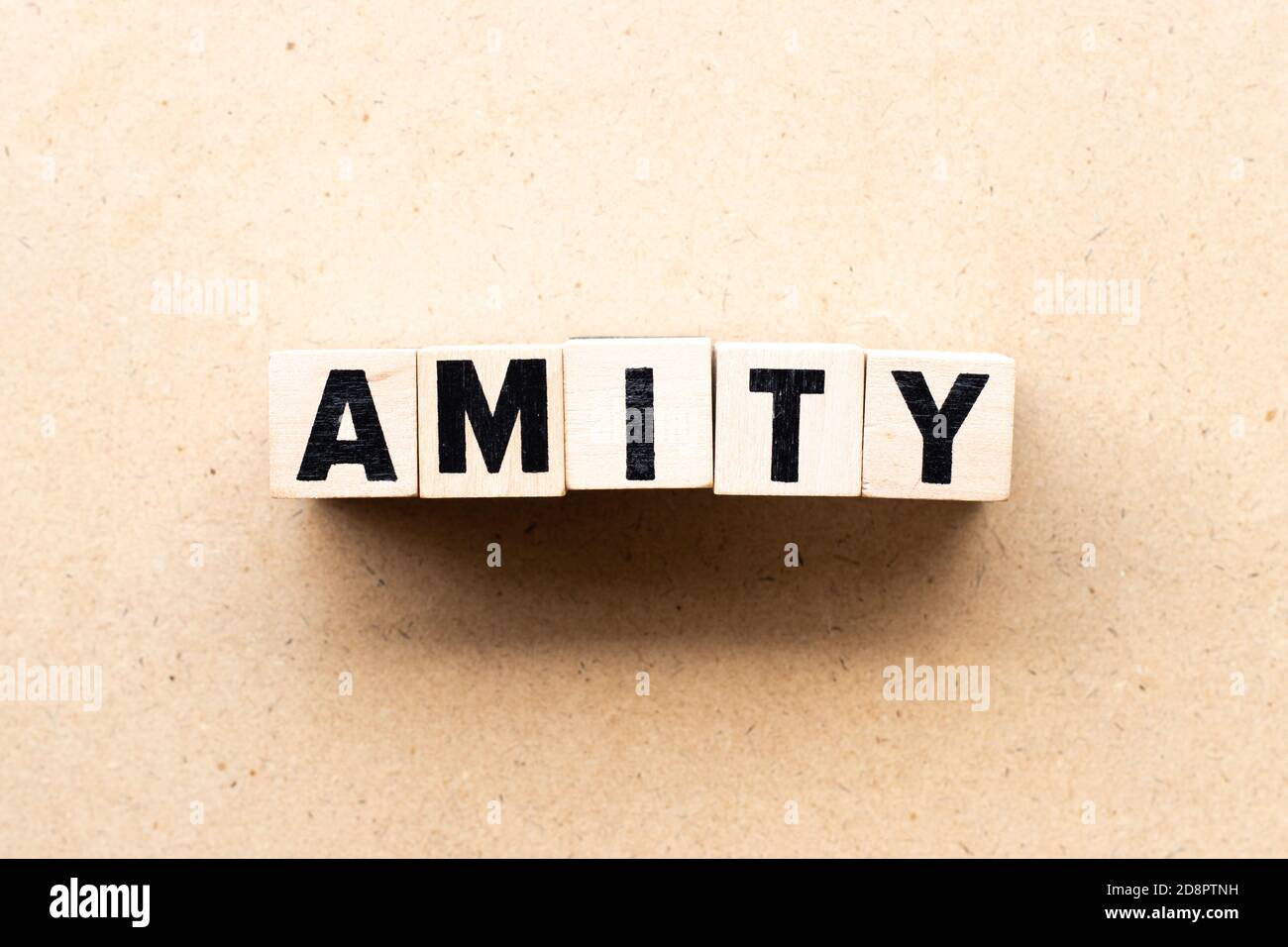 Letter block in word amity on wood background Stock Photo - Alamy