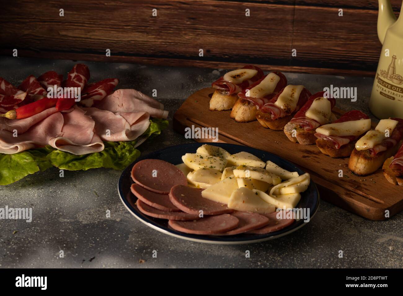 Table and arrangement of cold cuts - hams, bondiola -, cheeses and ...