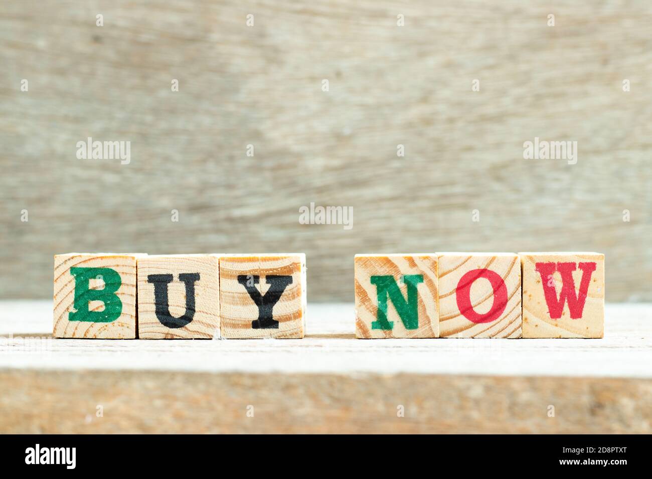 Alphabet letter in word buy now on wood background Stock Photo - Alamy