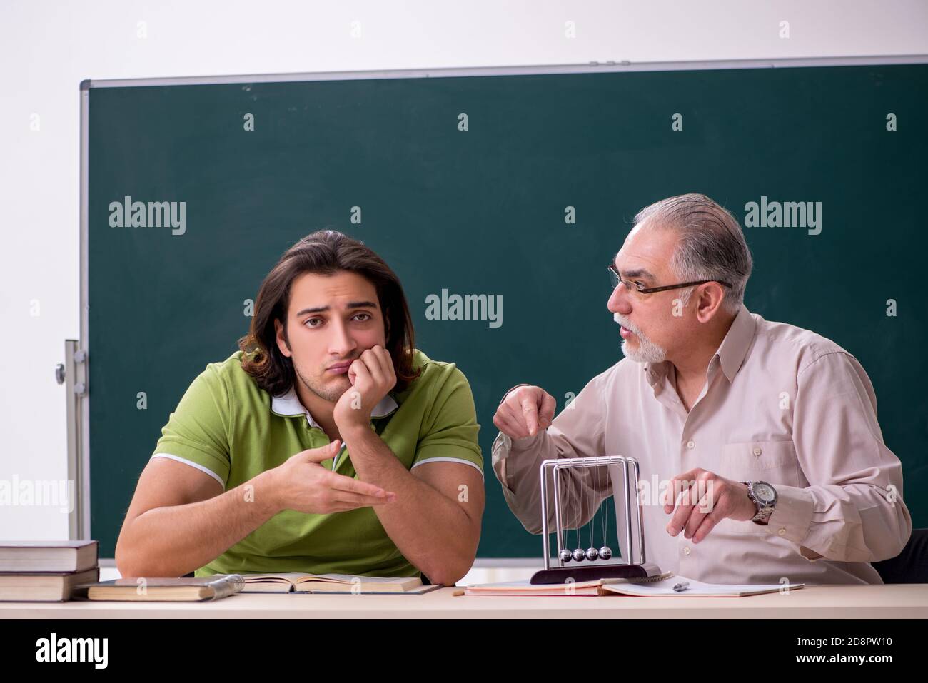 Old professor physicist and student in the classroom Stock Photo - Alamy
