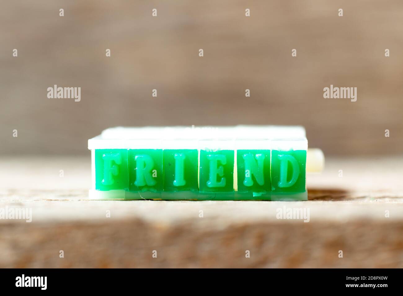 Green color rubber stamp in word friend on wood background Stock Photo ...