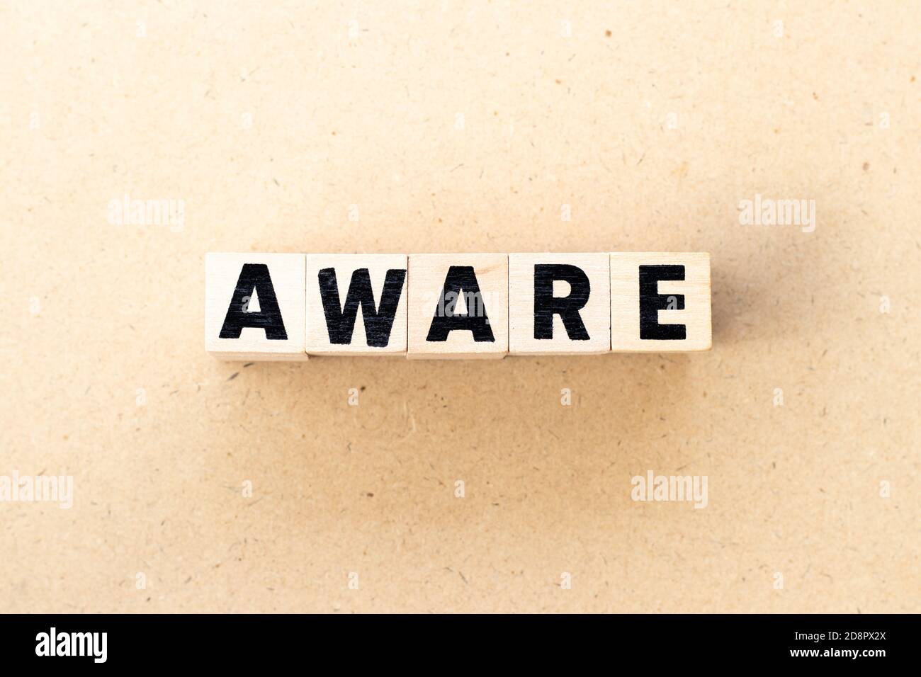Alphabet letter block in word aware on wood background Stock Photo - Alamy
