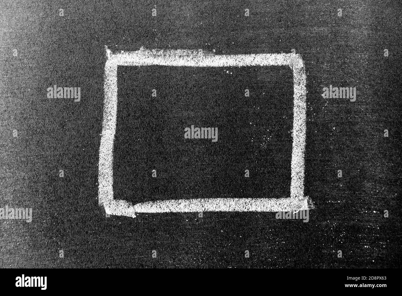White chalk hand drawing in square or banner shape on black board ...