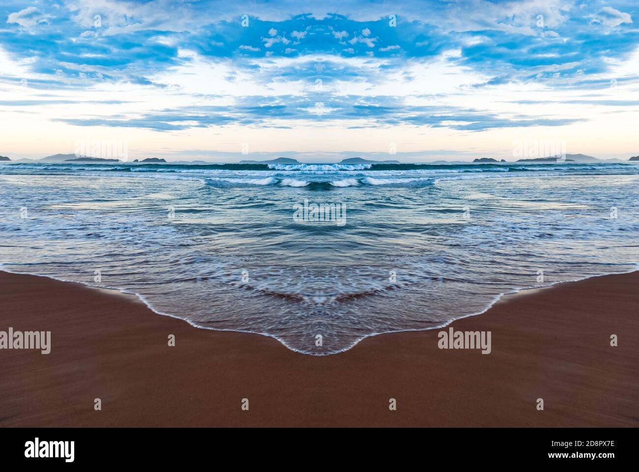 Mesmerizing sea under the cloudy sky with a mirror effect Stock Photo ...