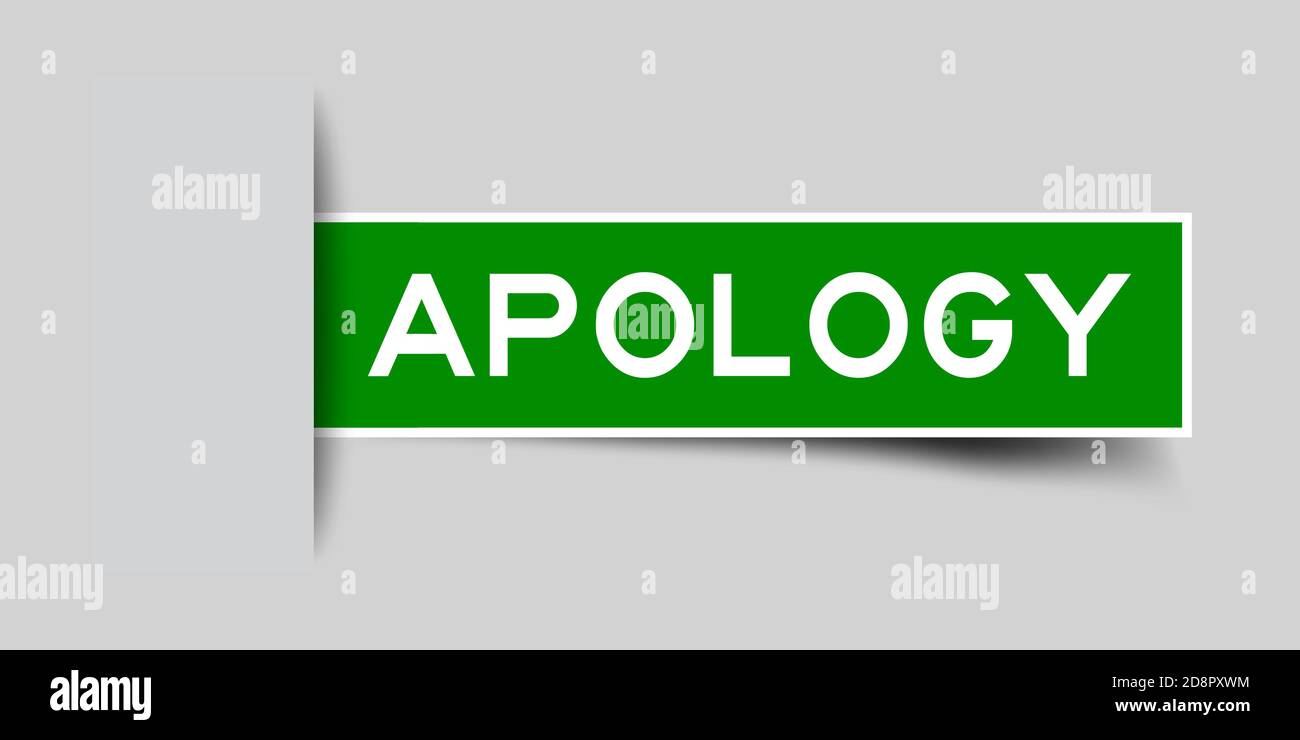 Inserted green color label sticker with word apology on gray background ...