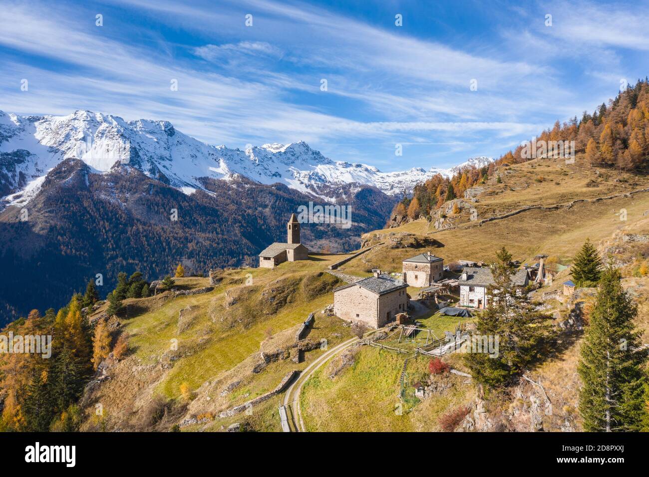 Valposchiavo, pasture of San Romerio with little huts and church Stock ...