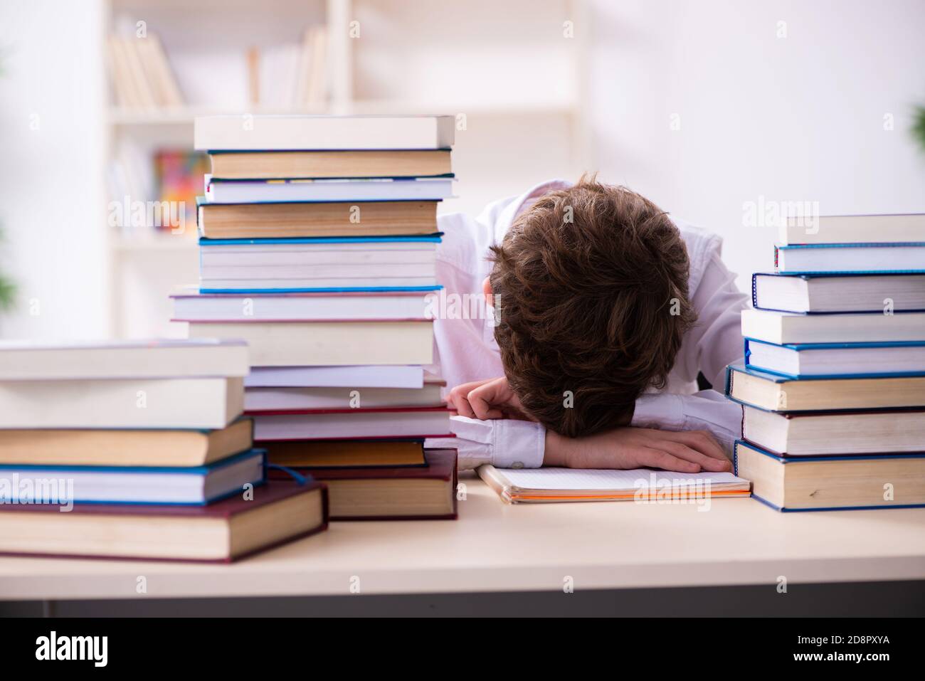 Schoolboy preparing for exam in the classroom Stock Photo - Alamy