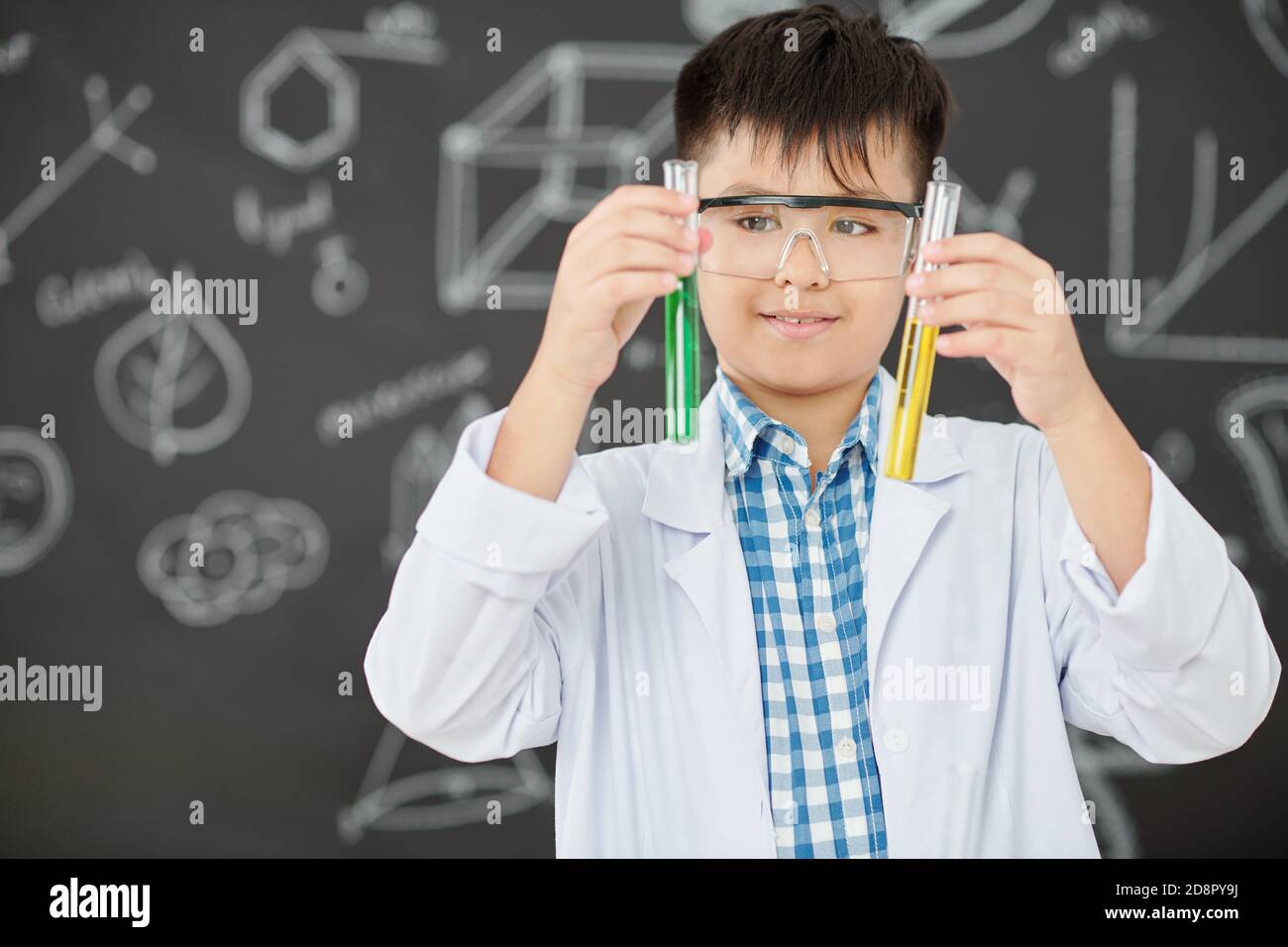 School student looking at test tubes Stock Photo - Alamy