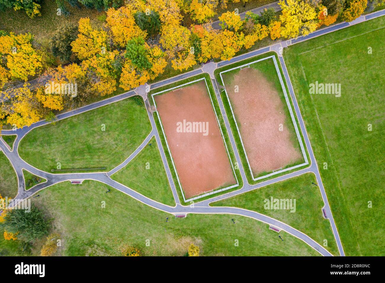 two public sports ground for soccer in colorful autumn park. top view ...