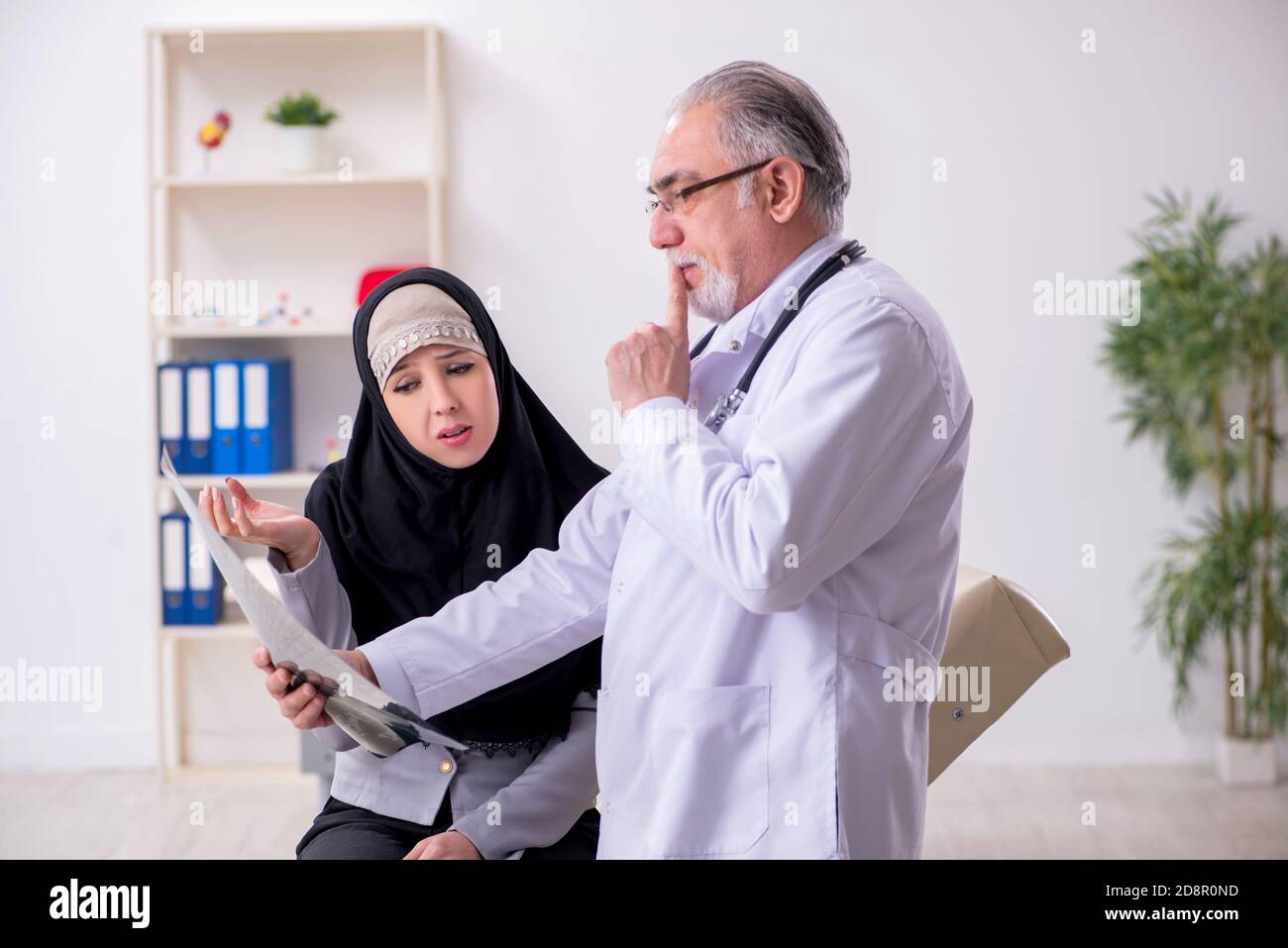Experienced doctor discussing mri scan hi-res stock photography and ...