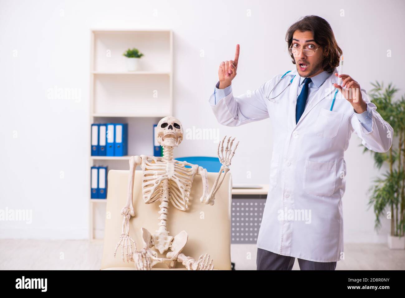 Crazy doctor examining the dead patient Stock Photo - Alamy