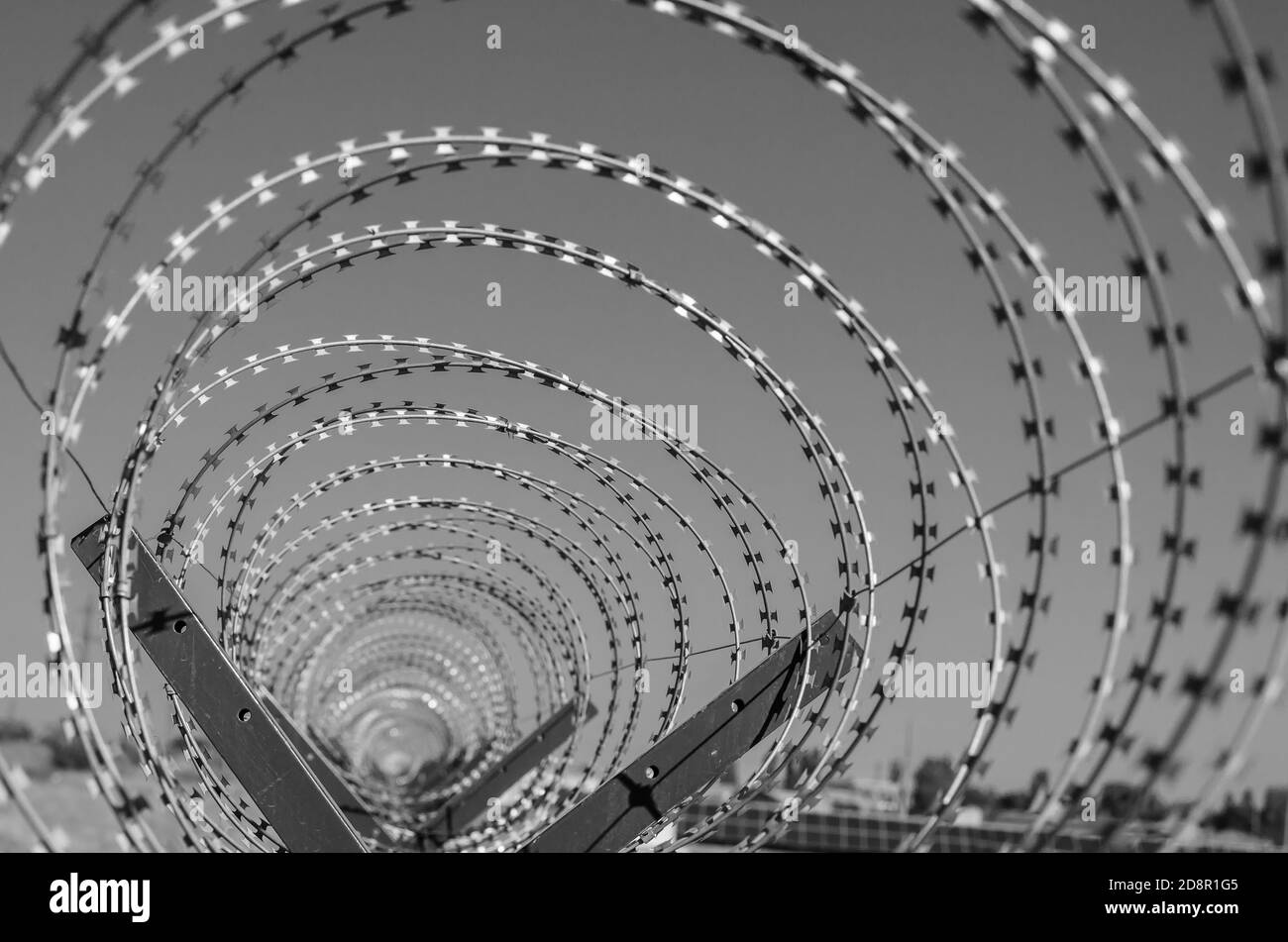 Razor wire fence perspective Black and White Stock Photos & Images - Alamy