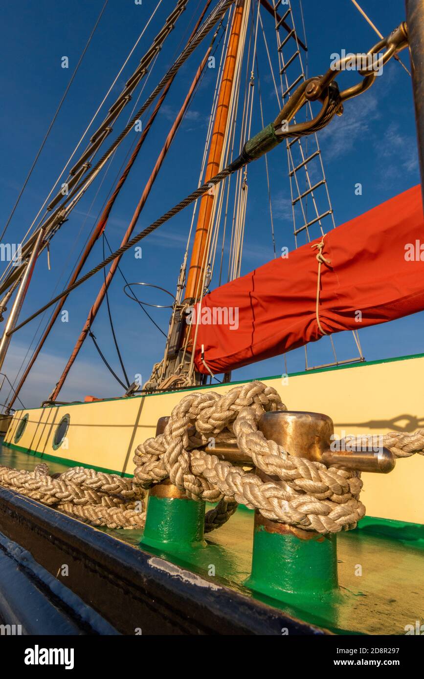 a maritime or nautical themed image of brass bollards masts, sails and ...