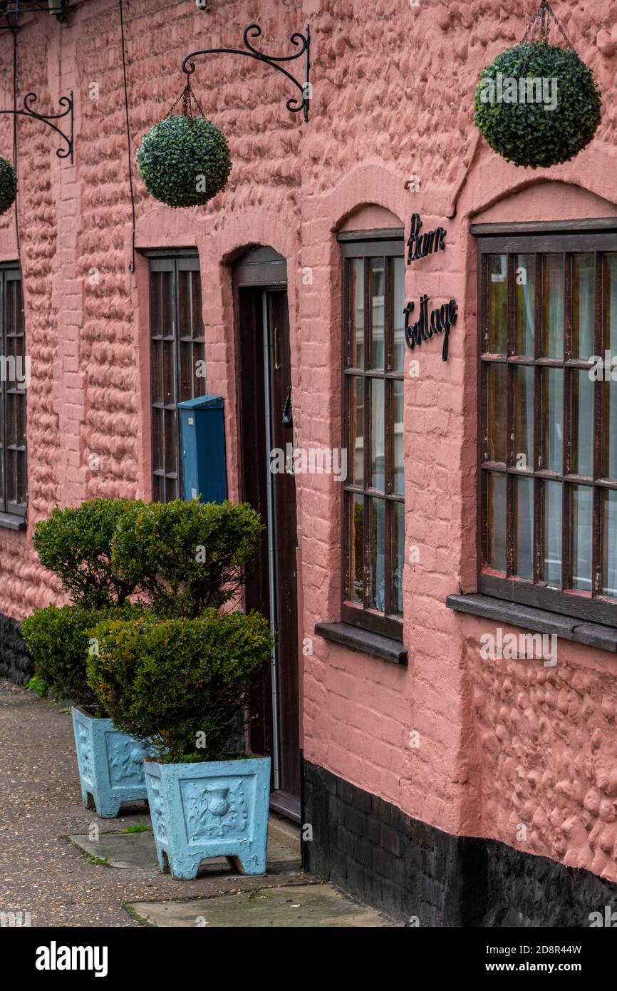 twee and pretty cottages in an english village painted in bright pink ...