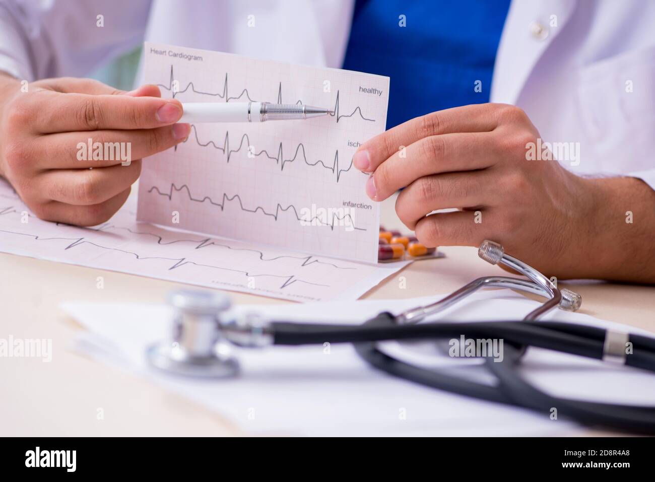 Young doctor cardiologist working in the clinic Stock Photo - Alamy