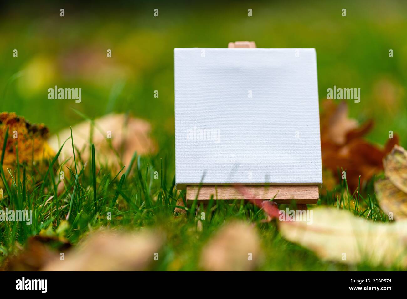 Closeup of a small canvas on a stand on the ground with space for text ...