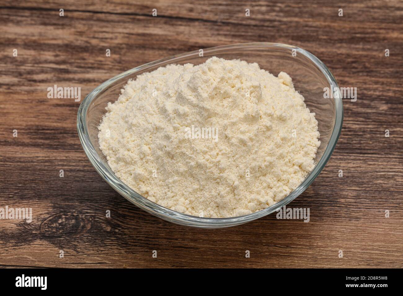Wheat flour heap in the bowl for cooking Stock Photo - Alamy